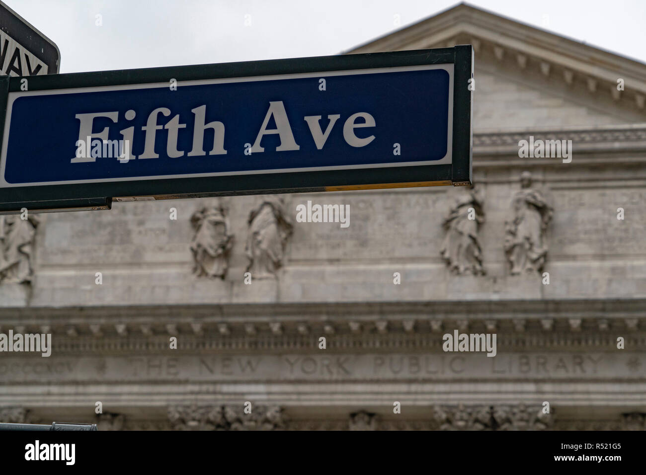 fifth avenue sign new york city with library way street Stock Photo - Alamy