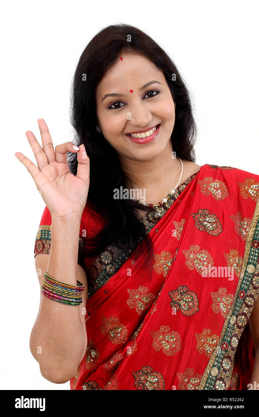 Traditional Indian Young woman making OK sign Stock Photo - Alamy