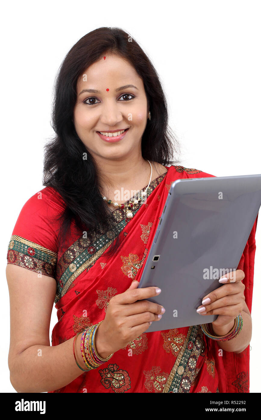 Traditional Indian woman using a tablet computer Stock Photo - Alamy