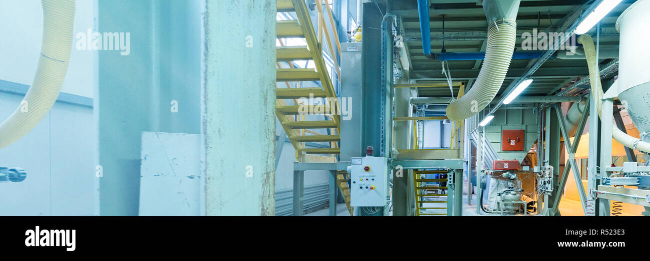 Fiberglass production industry equipment at manufacture background ...