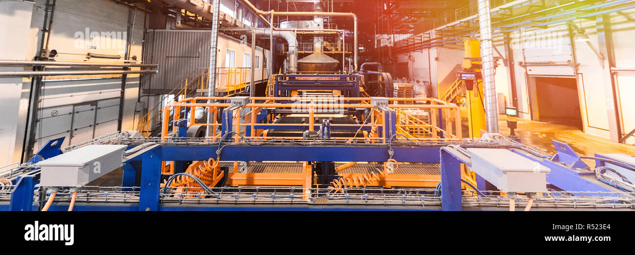 Fiberglass production industry equipment at manufacture background ...