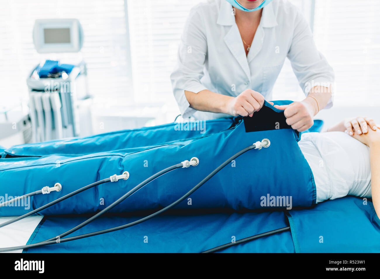 legs pressotherapy machine on woman patient in hospital bed Stock Photo ...
