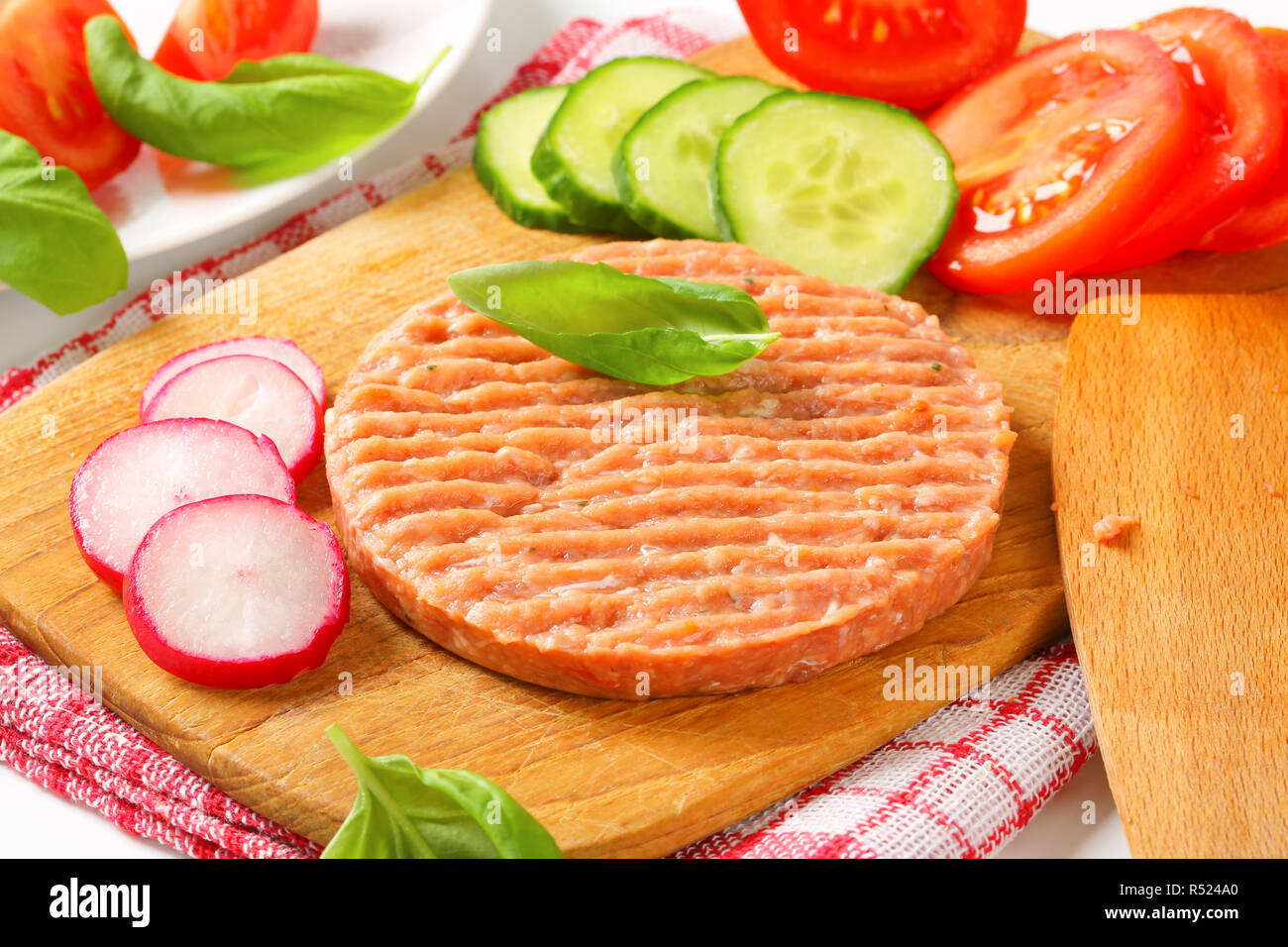 Raw minced meat patty Stock Photo - Alamy