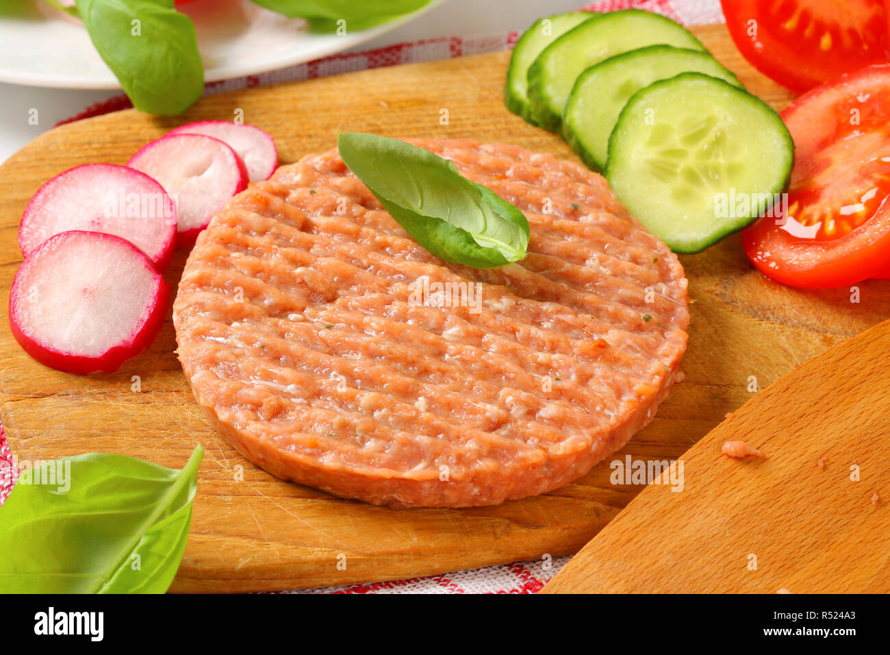 Raw minced meat patty Stock Photo - Alamy