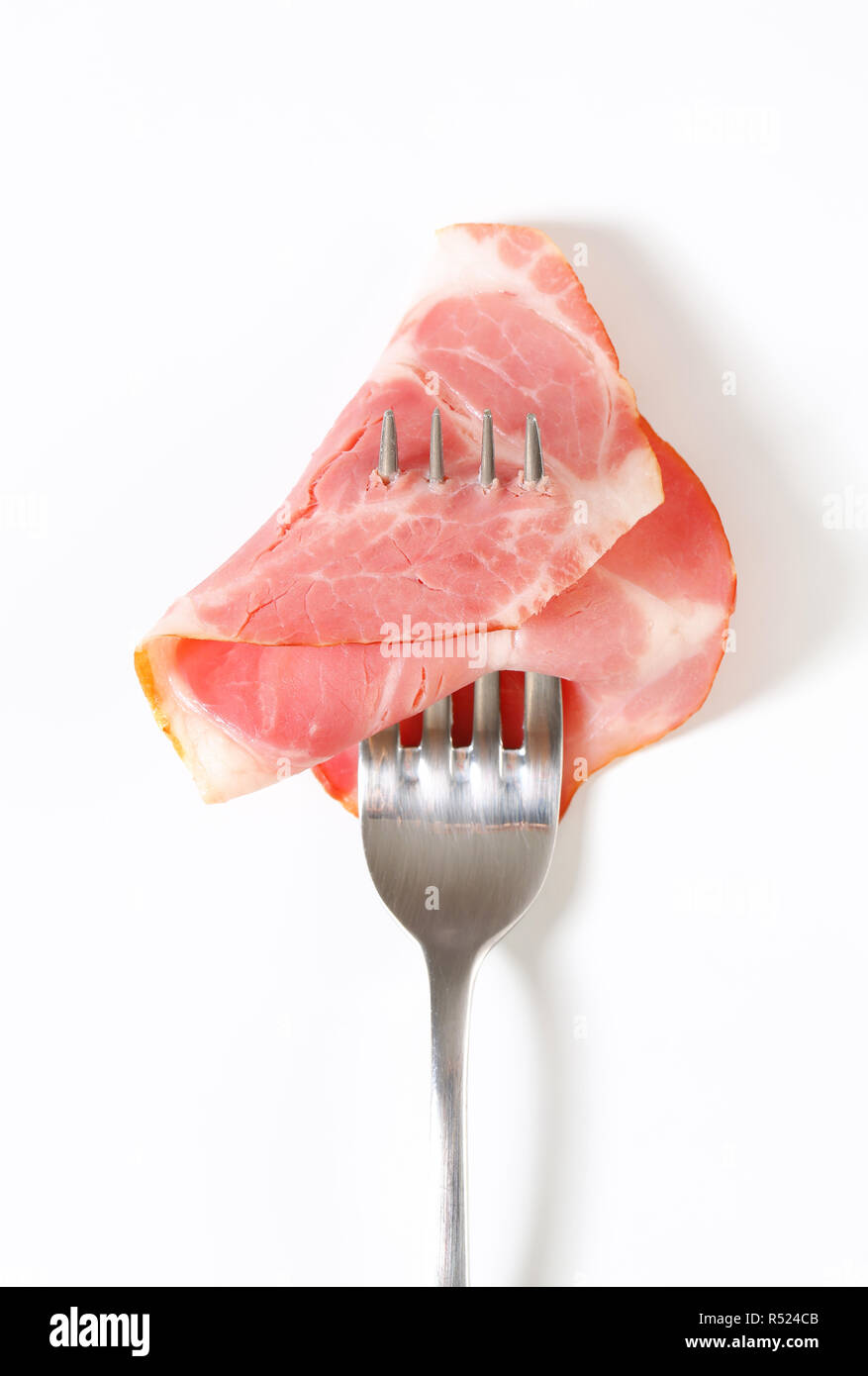 Smoked pork on fork Stock Photo - Alamy