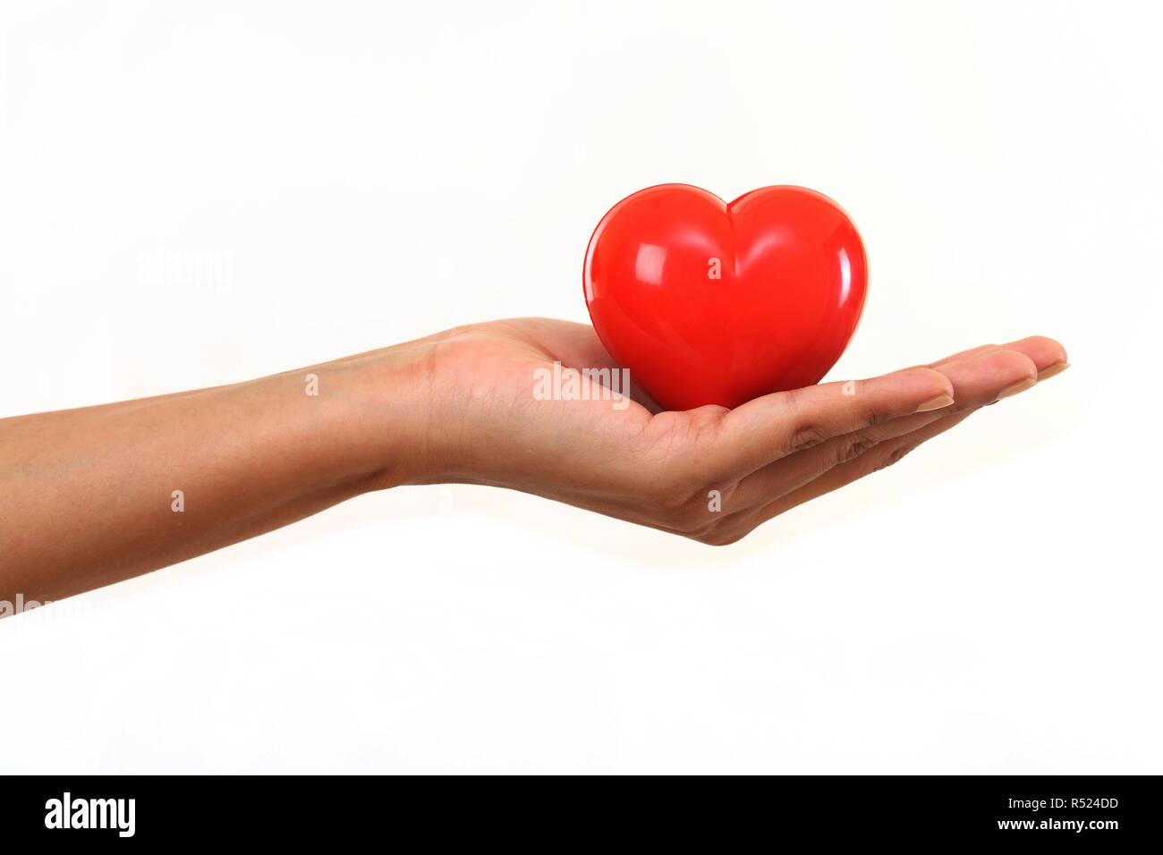 Hand holding Red heart shape Stock Photo - Alamy