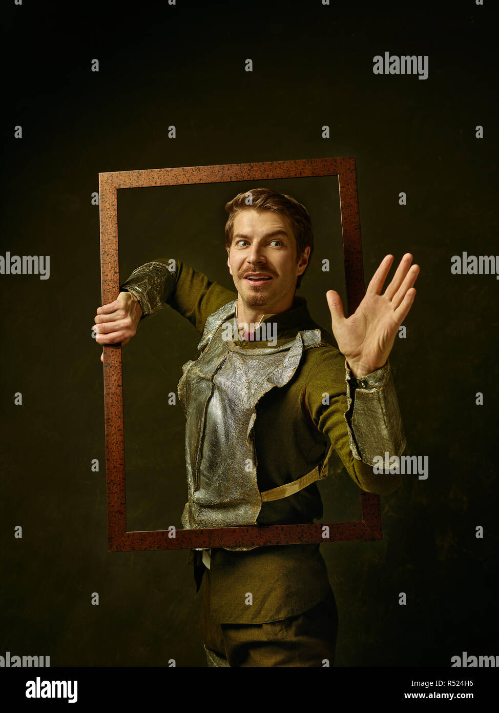 Medieval knight on dark studio background. Portrait in low key of ...