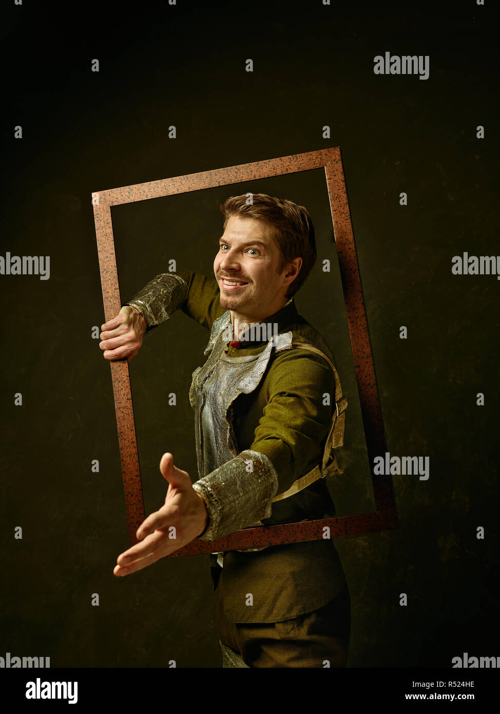 Medieval knight on dark studio background. Portrait in low key of ...