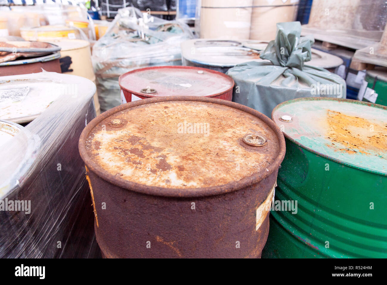 Old, rusty barrels with toxic chemical waste Stock Photo - Alamy