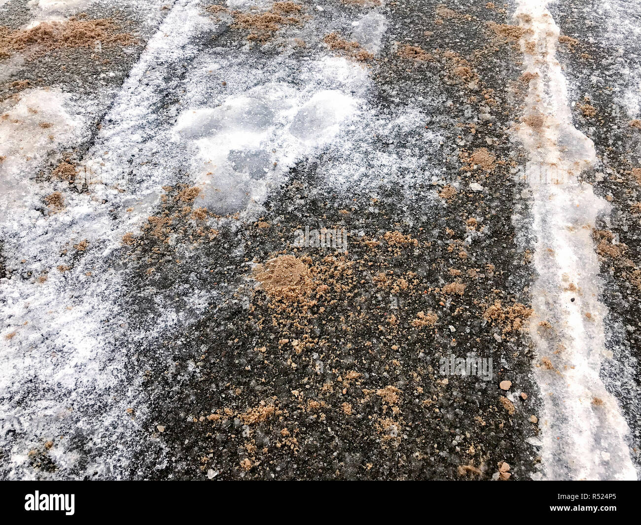 Slippery ice and snow on the sidewalk Stock Photo - Alamy