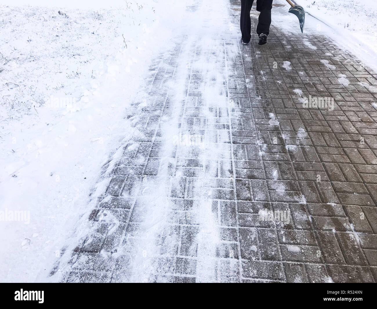 Male worker cleaning the road from the snow hi-res stock photography ...