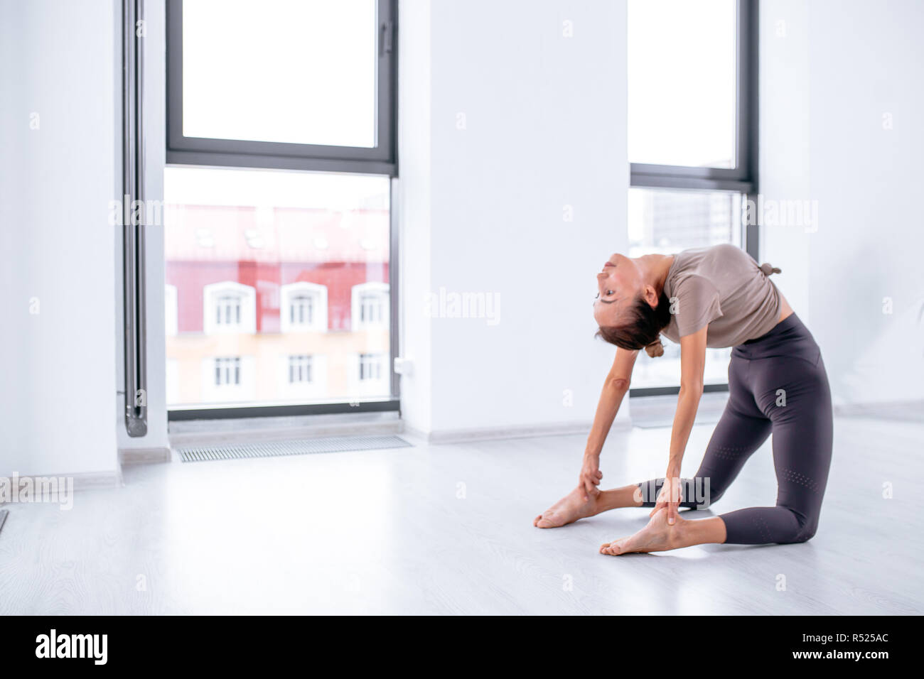 dancing woman doing movement with bent back Stock Photo - Alamy