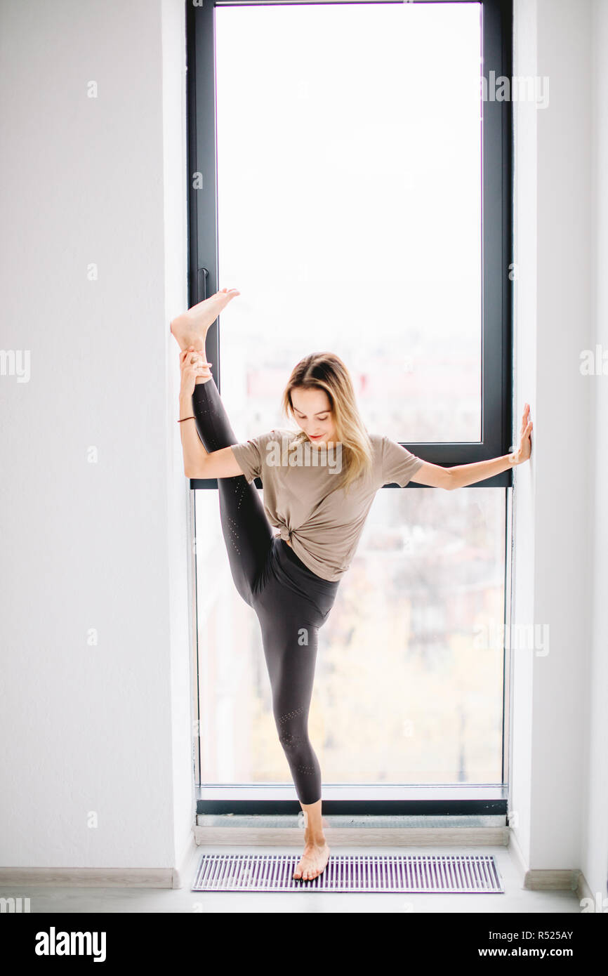 happy smiling gymnast girl wearing working out in the modern studio ...