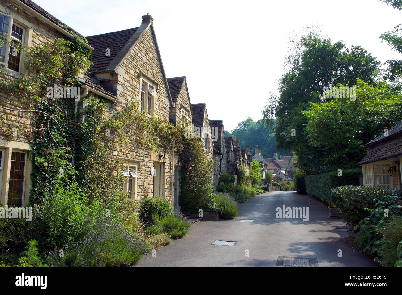 Quaint homes in the Cotswold village of Castle Combe, United Kingdom ...