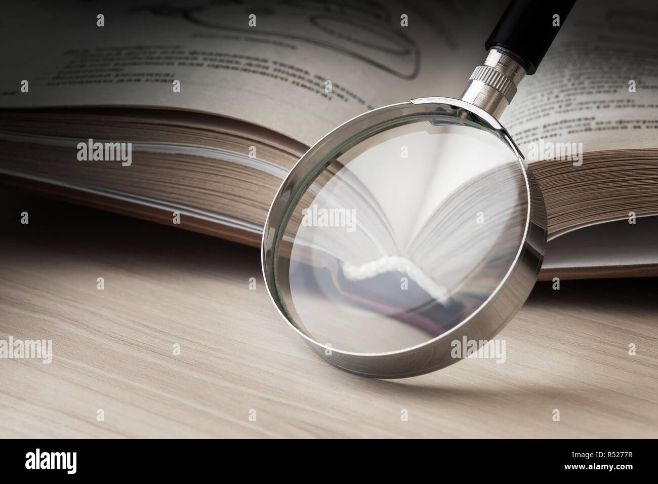 Book magnifying glass concept education hi-res stock photography and ...