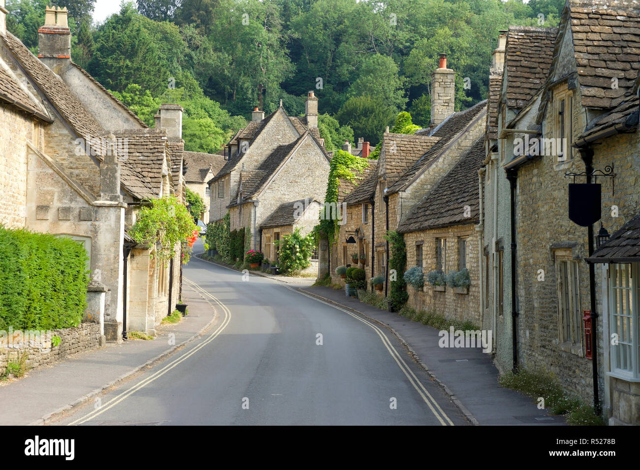 Quaint homes in the Cotswold village of Castle Combe, United Kingdom ...