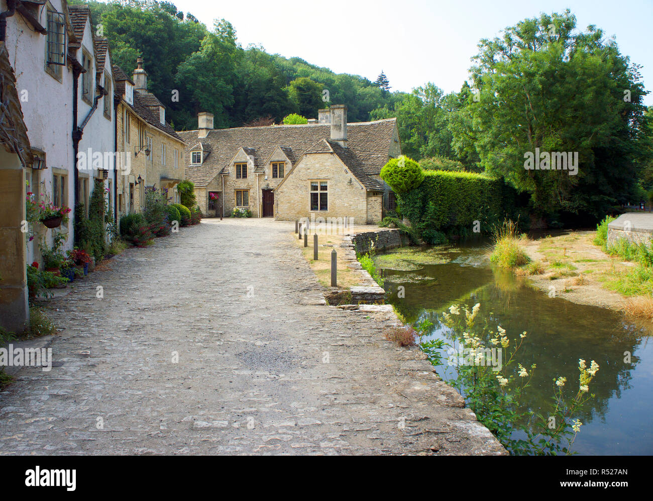 Quaint homes in the Cotswold village of Castle Combe, United Kingdom ...