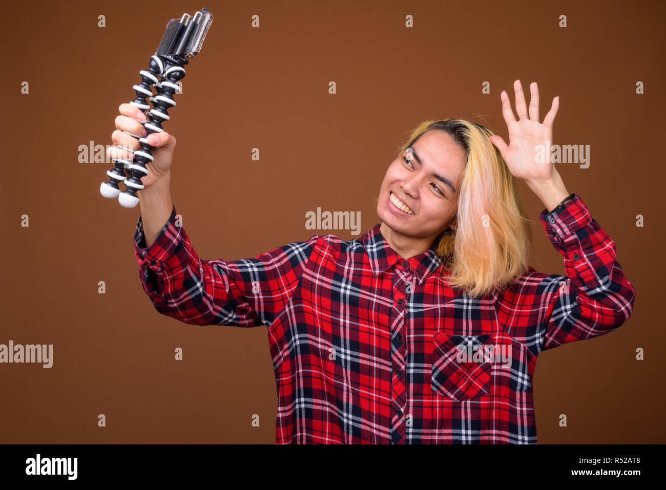 Young Asian Filipino man influencer vlogging in studio Stock Photo - Alamy