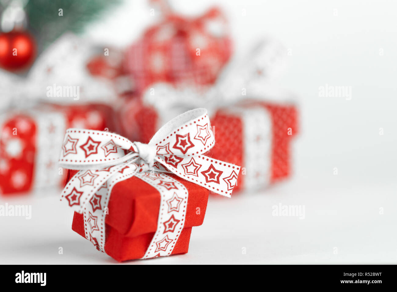 Red Christmas gift boxes on white background Stock Photo - Alamy