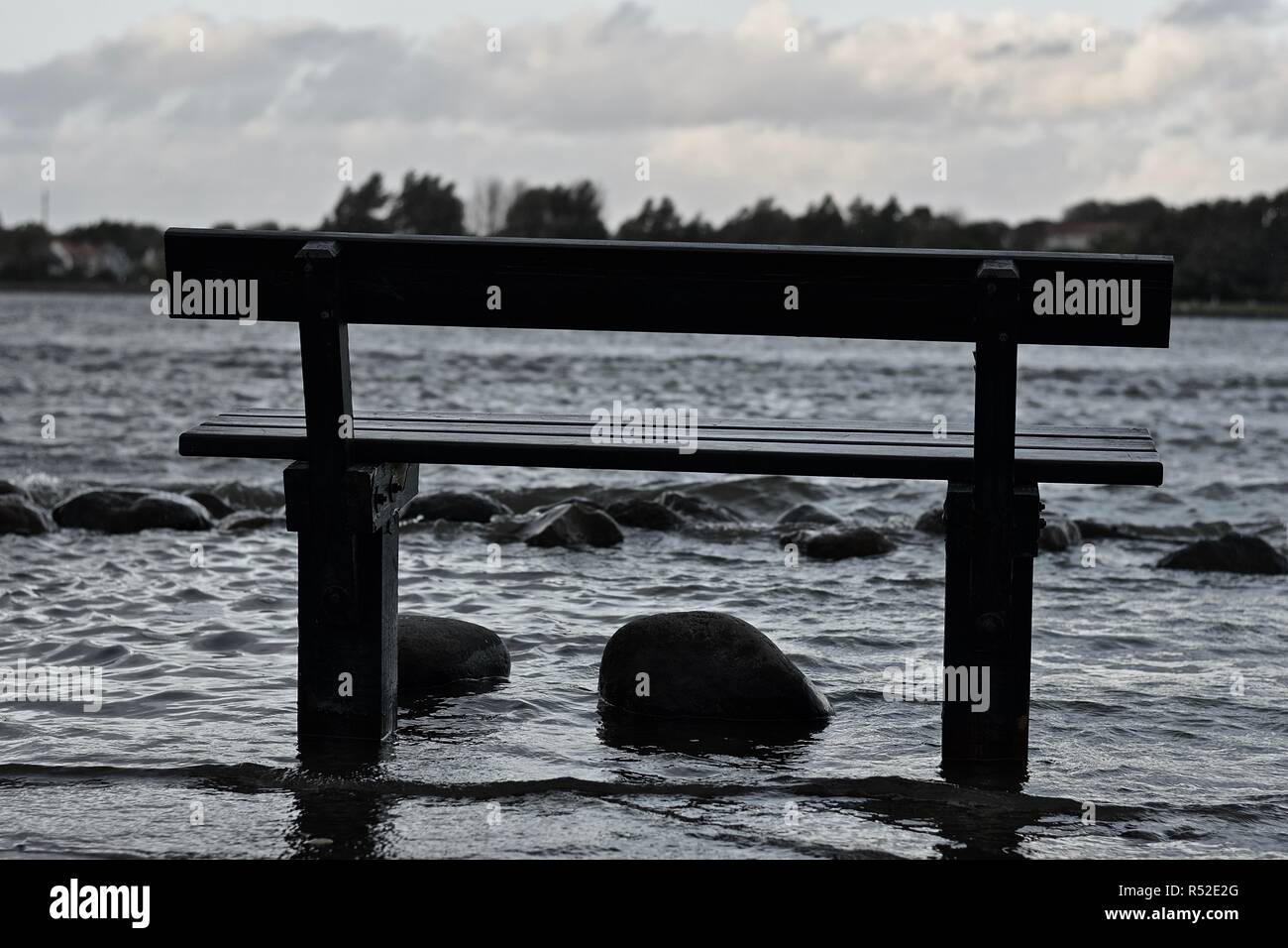 Bench in water Stock Photo - Alamy