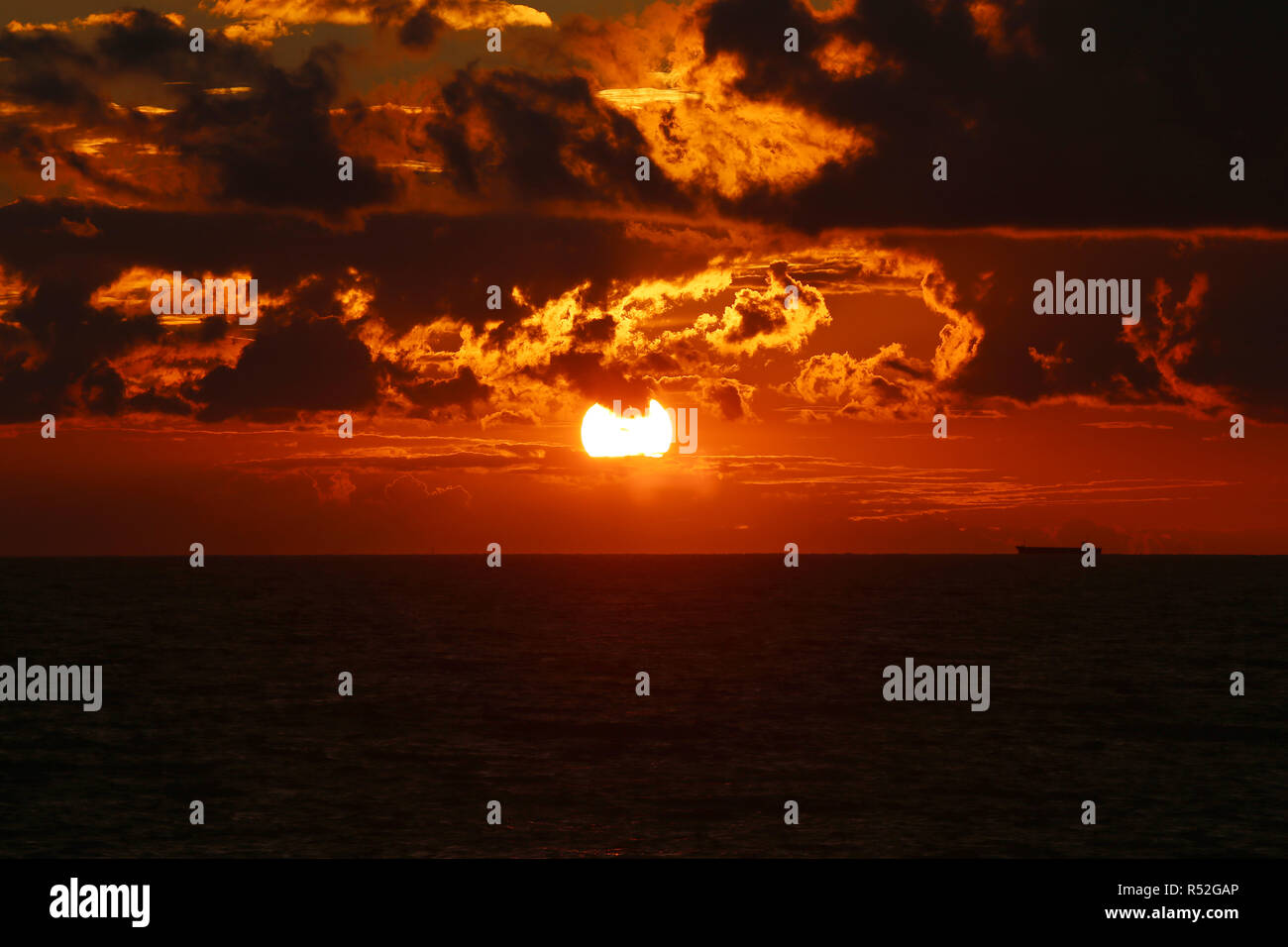 Brighton sunset with a ship on the horizon Stock Photo - Alamy