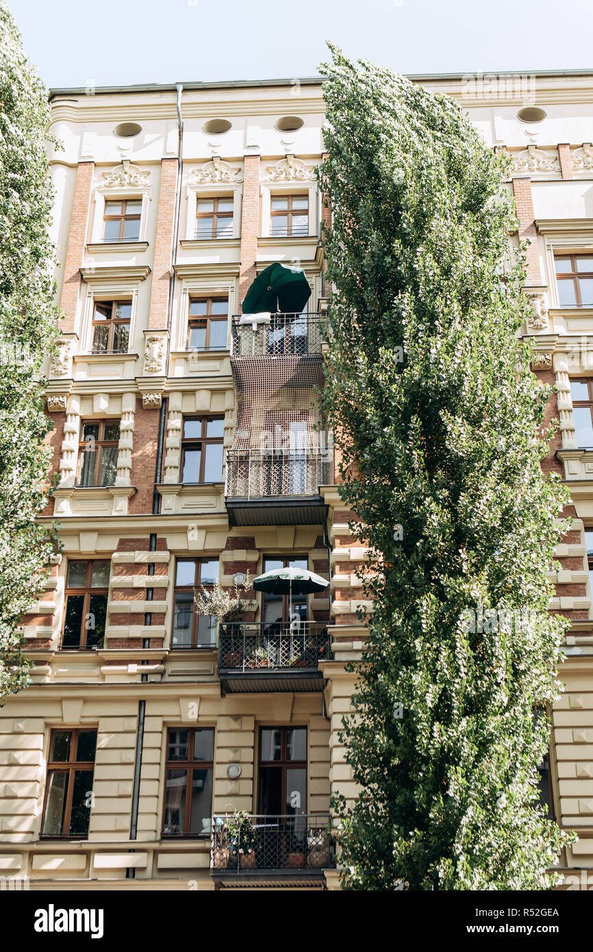 Traditional residential building with many windows and balconies in ...