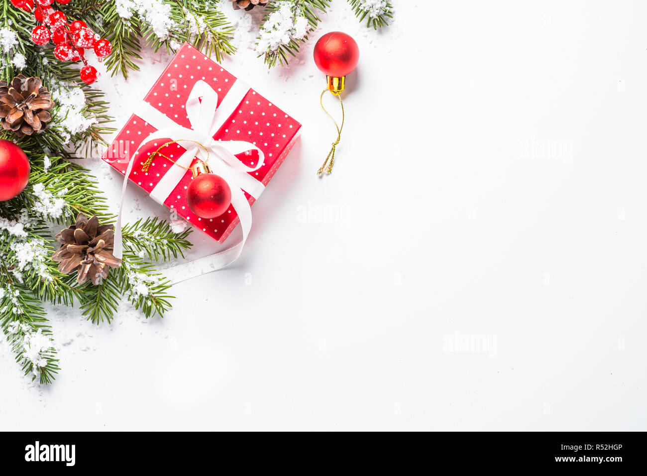 Christmas background with present and decorations on white Stock Photo ...