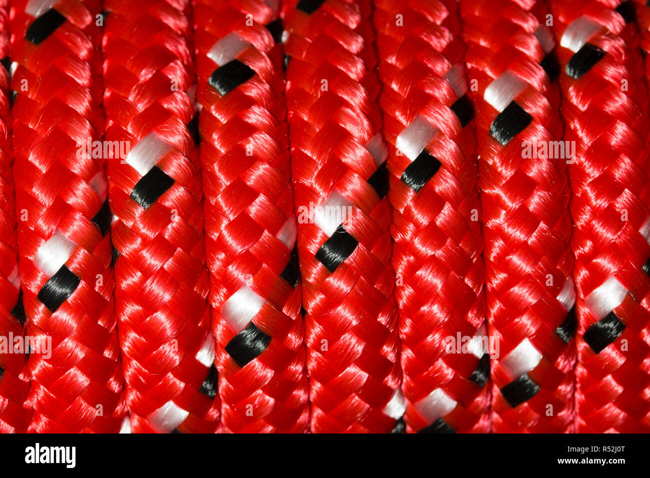Extreme close up of new colourful red nylon rope Stock Photo - Alamy