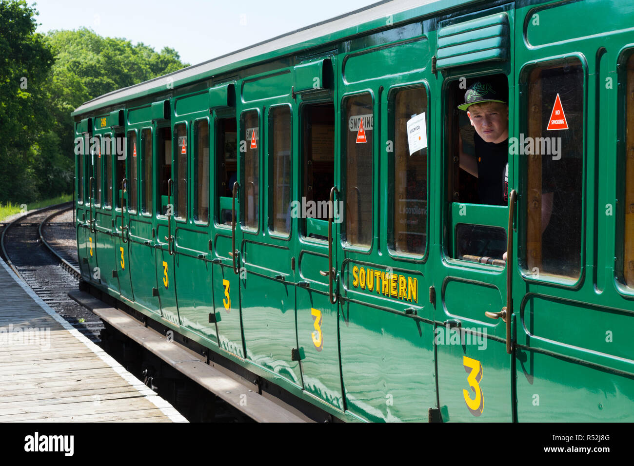 Passenger / passengers aboard Third / 3rd class train carriage on the ...