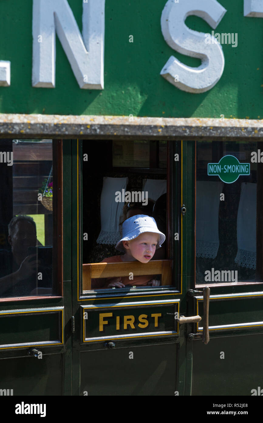Child passenger / passengers aboard First / 1st class train carriage on ...