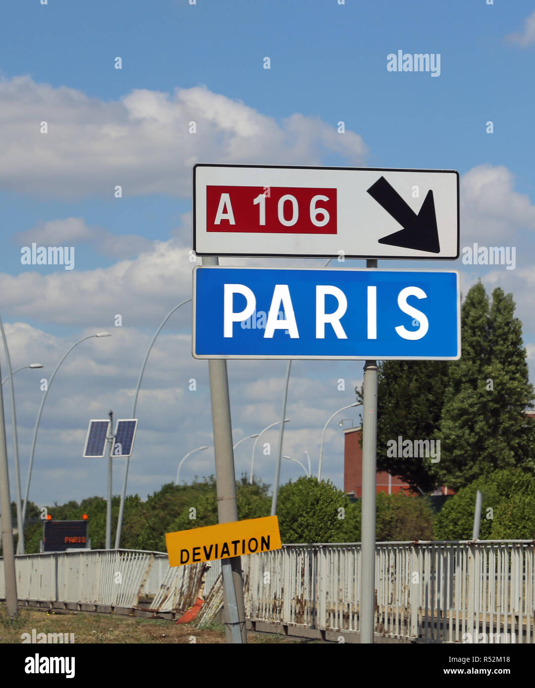 highway sign with directions to the city of Paris in France and the ...