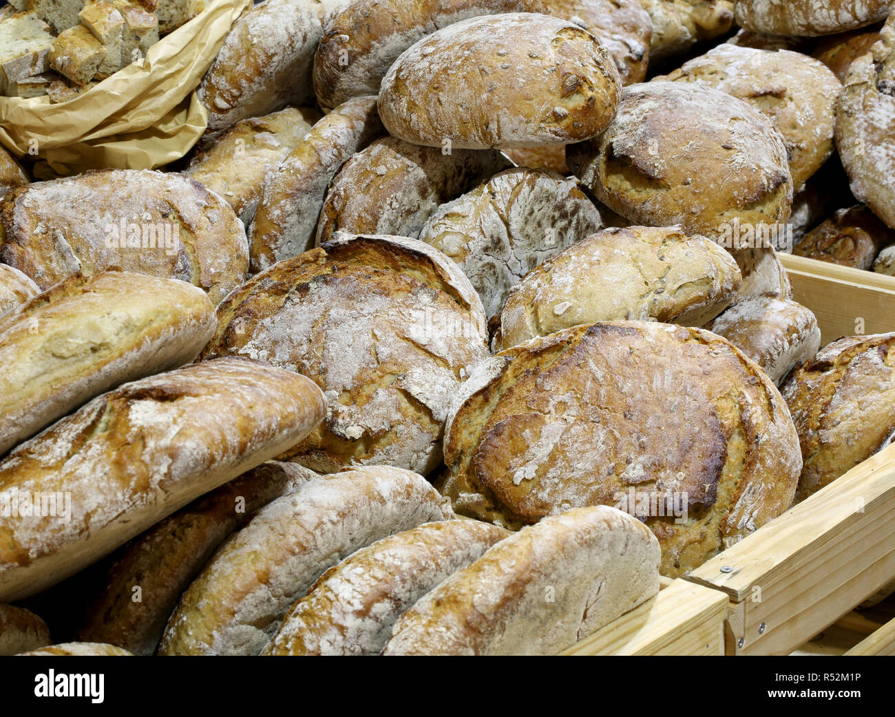 many loaves of wholemeal bread for sale in the organic food store Stock ...