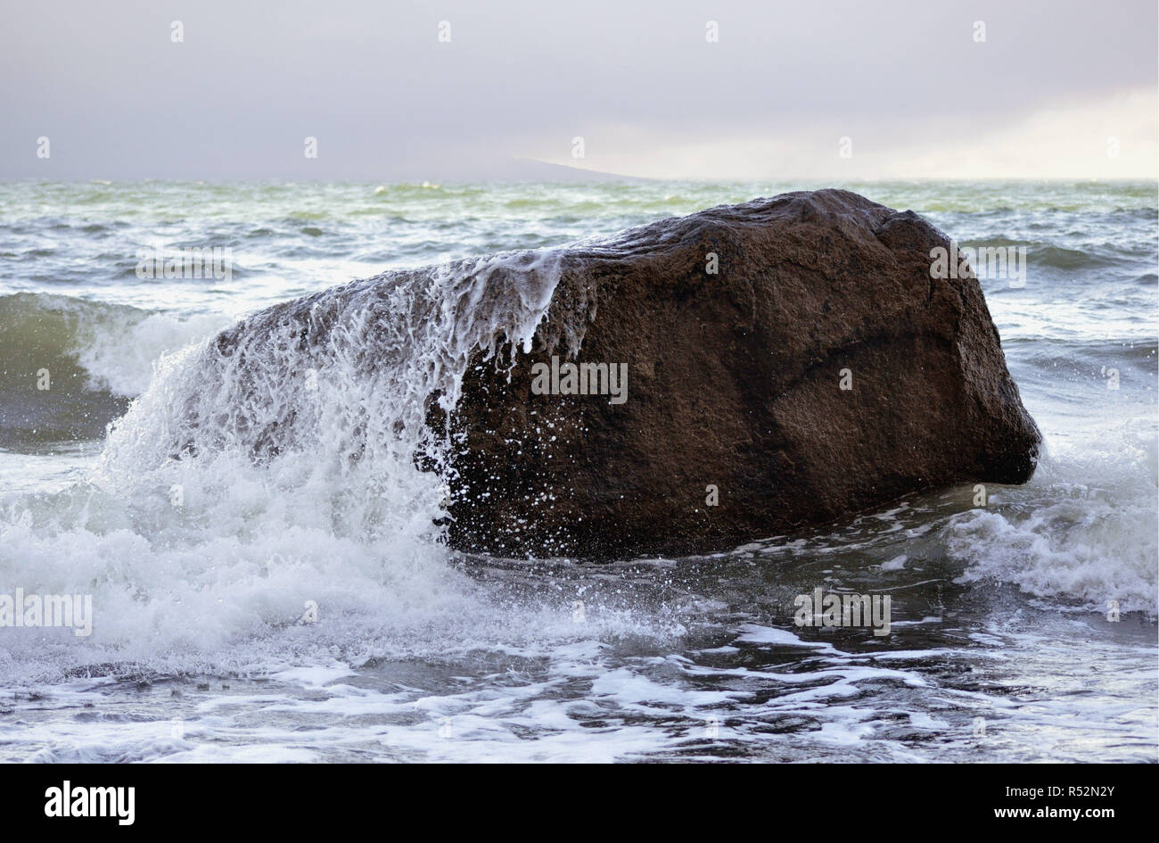rock in the surf Stock Photo - Alamy
