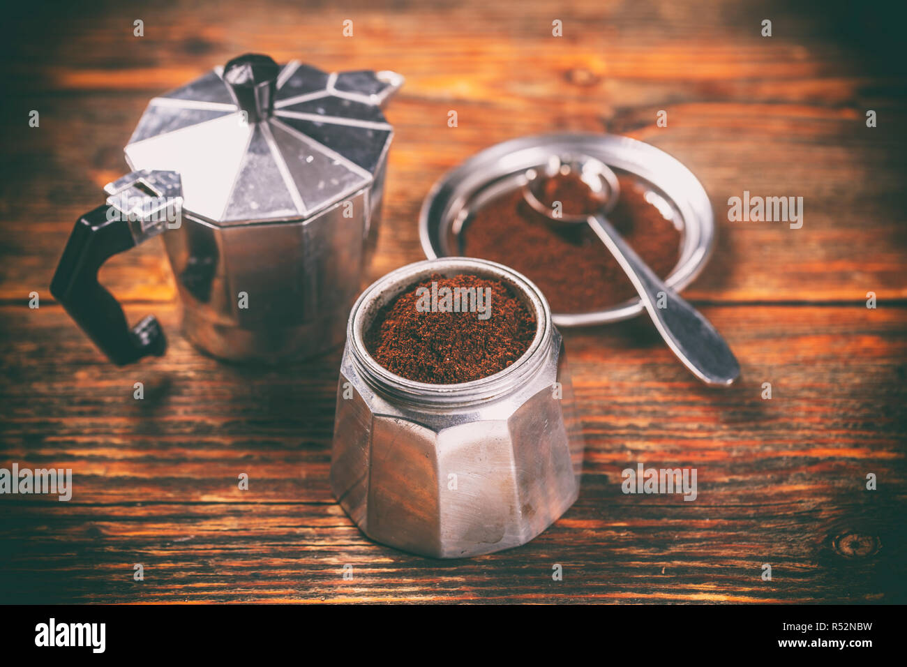 Ground coffee and moka pot Stock Photo - Alamy