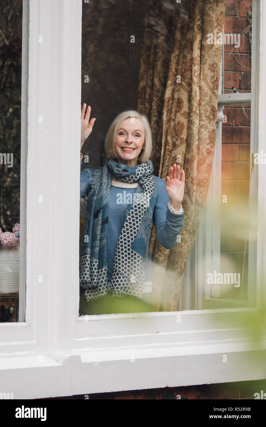 Waving goodbye to family hi-res stock photography and images - Alamy