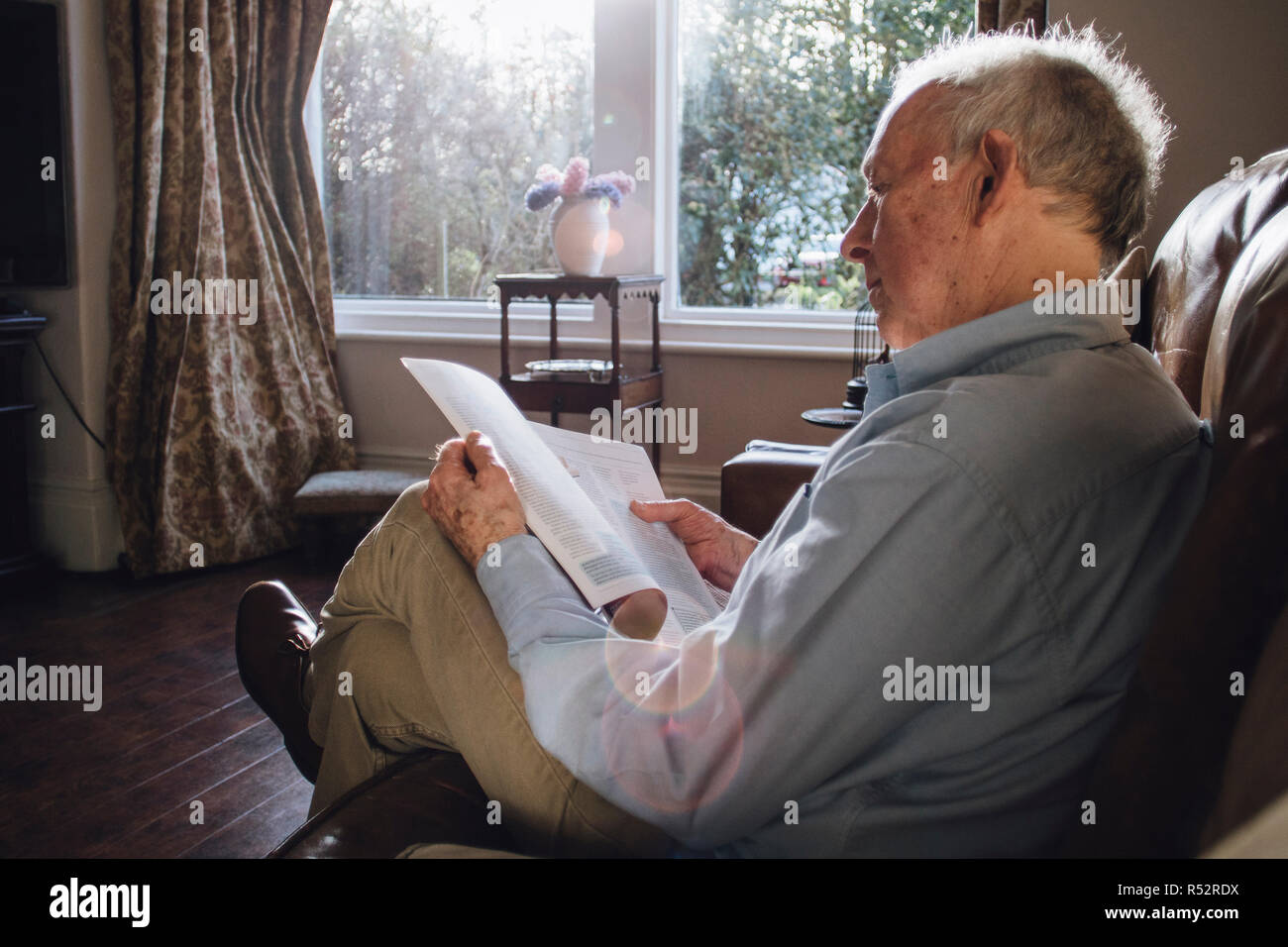 Reading The Paper Stock Photo - Alamy
