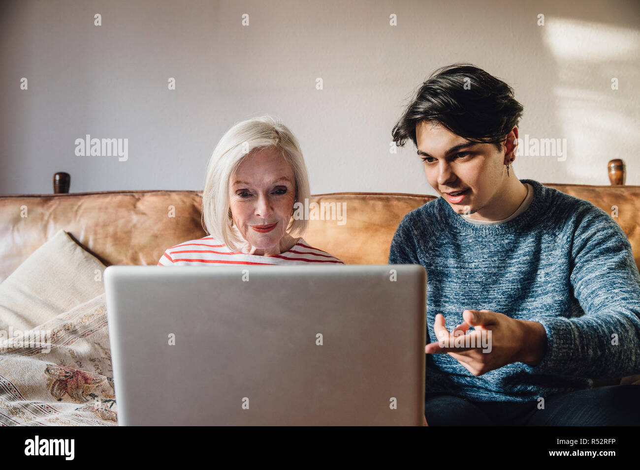 Introducing Grandmother To Technology Stock Photo - Alamy