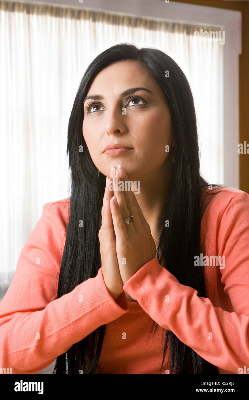 Pious looking woman hi-res stock photography and images - Alamy