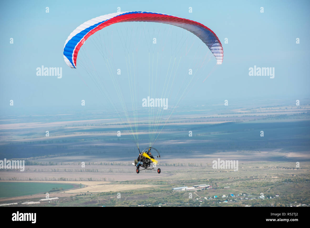 Paragliding in mountains Stock Photo - Alamy