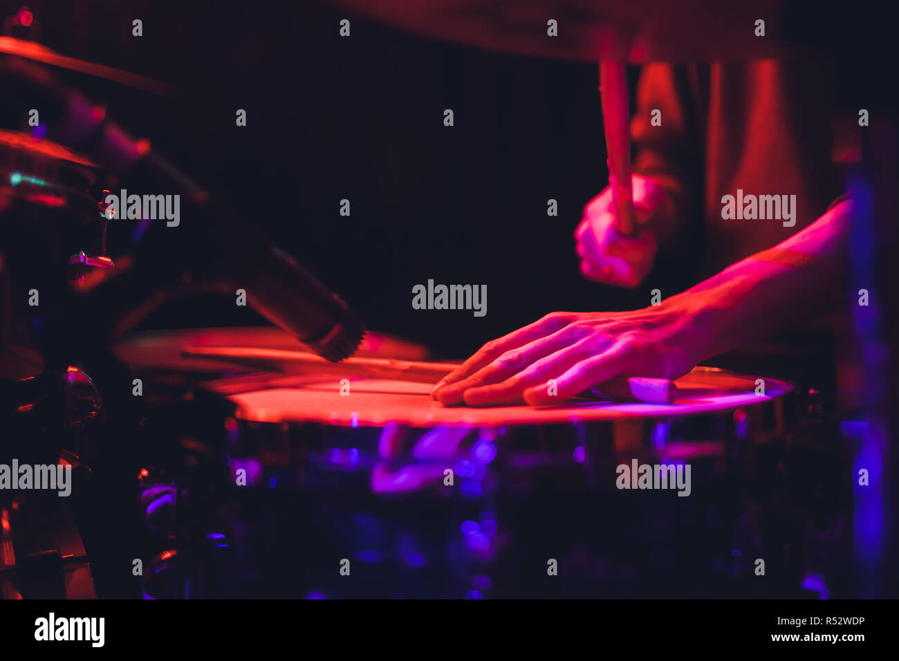 Human hands playing the drum with drumstick Stock Photo - Alamy