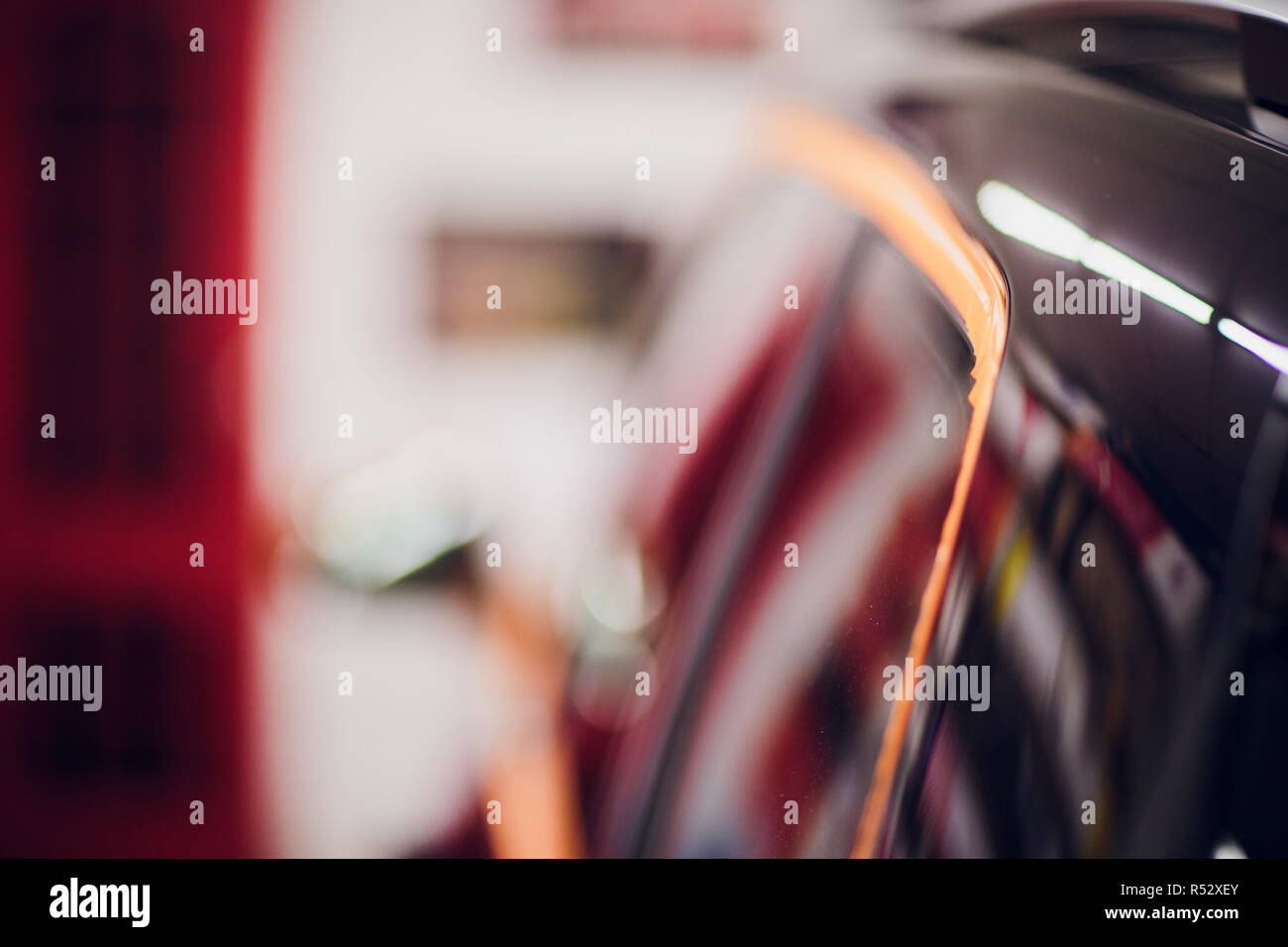 Car body work after the accident by working sanding primer before ...