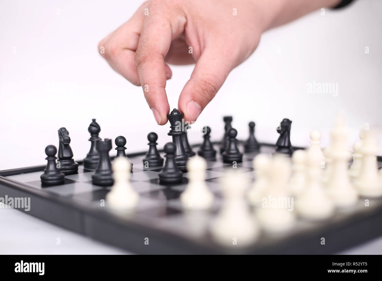 Picture of hand is playing chess. Isolated on the white background ...