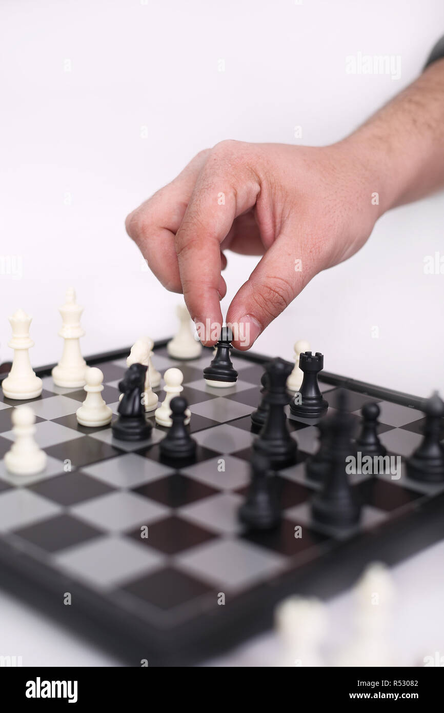 Man hand is playing chess. Isolated on the white background Stock Photo ...