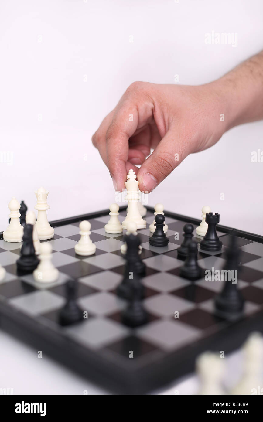 Picture of hand is playing chess. Isolated on the white background ...