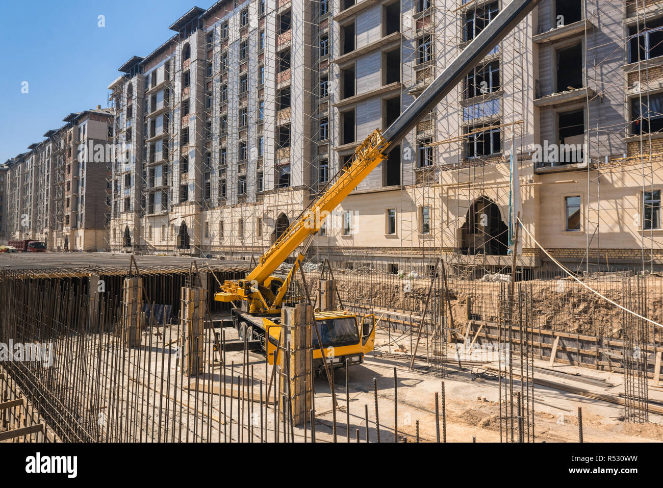 lifting machine on the construction site Stock Photo - Alamy