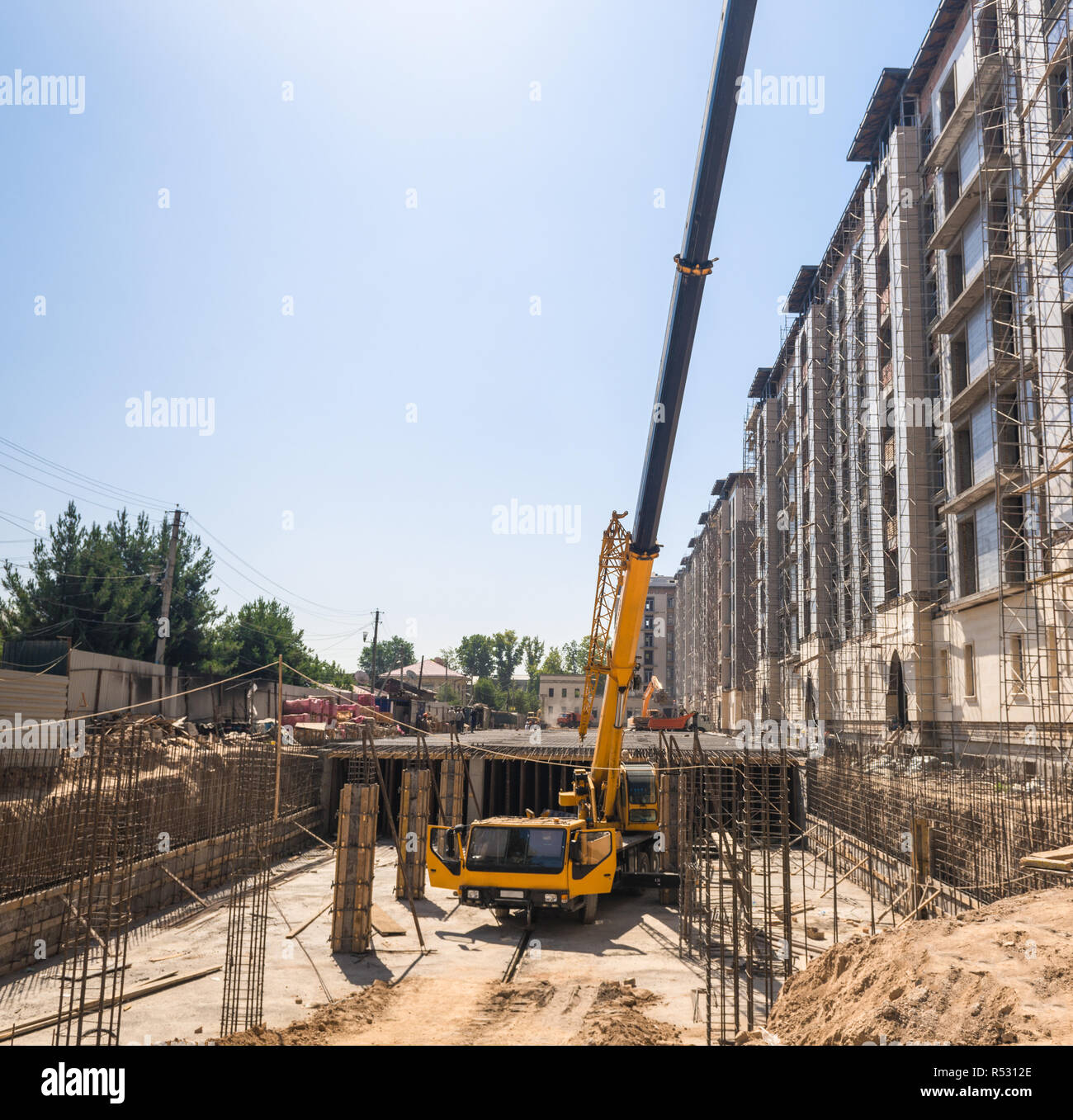 lifting machine on the construction site Stock Photo - Alamy