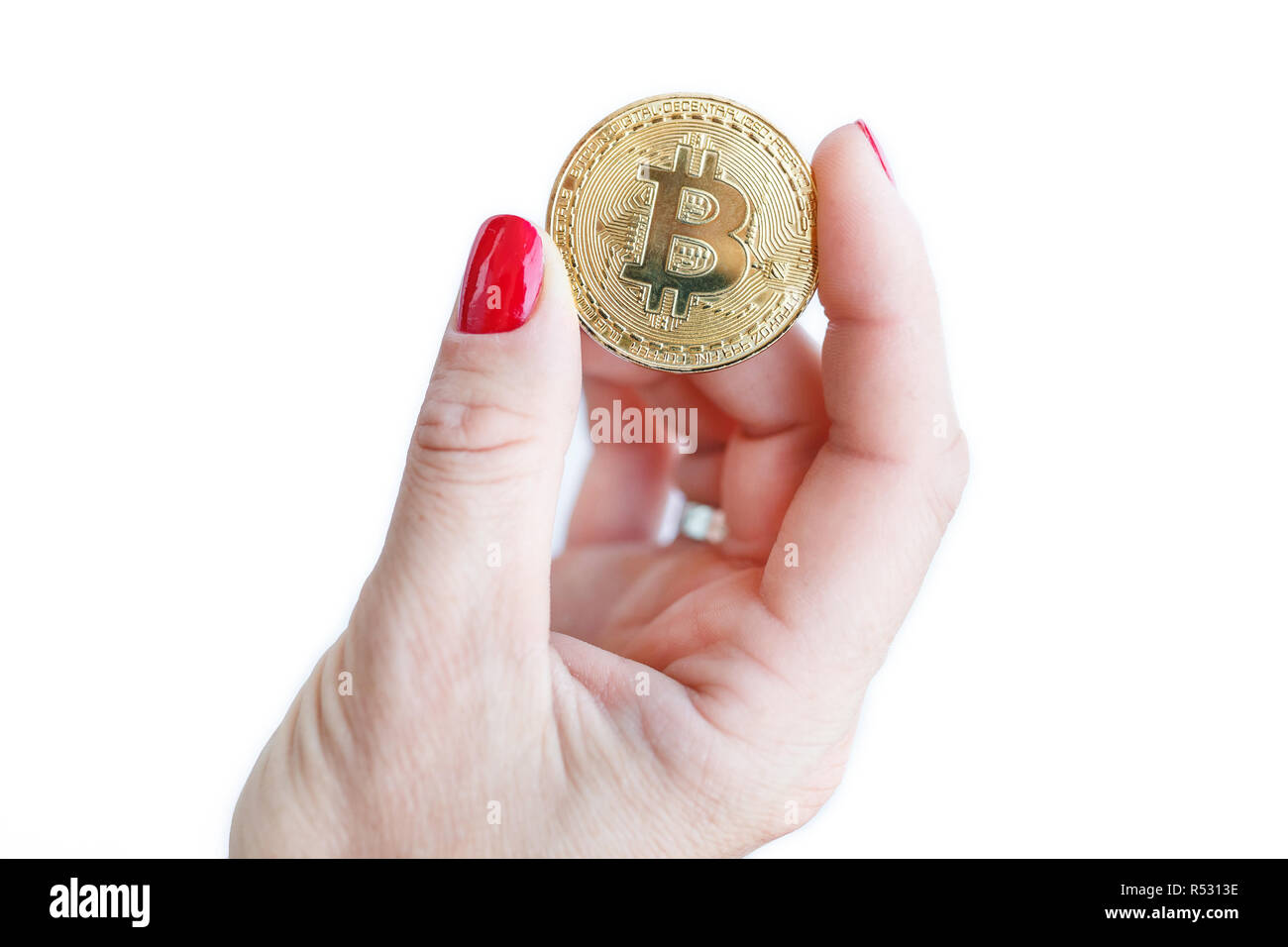 virtual money golden bitcoin women hand with red nails fingers isolated ...
