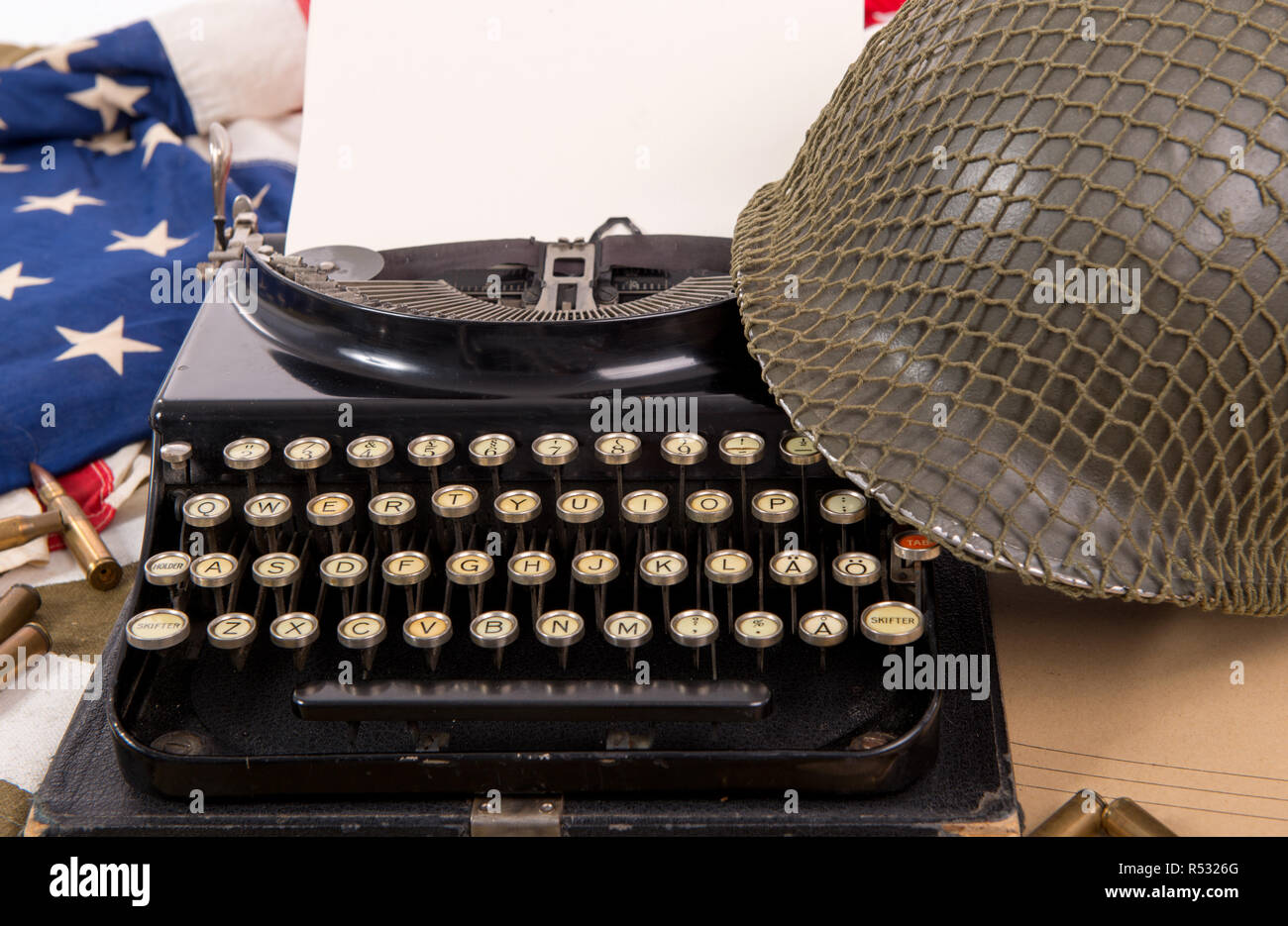 US military helmet of the Second World War with old typewriter Stock ...
