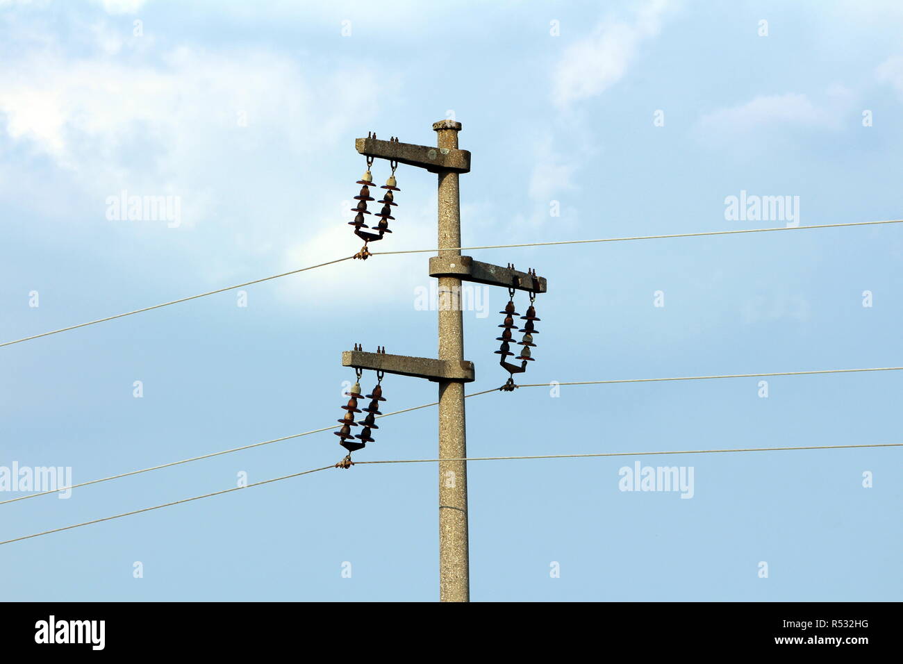 Concrete electrical power line utility pole with ceramic insulators and ...
