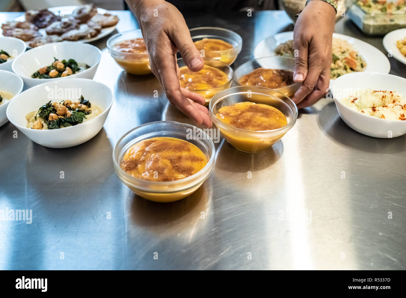 Cook plating their dishes and serving them hot and tasty Stock Photo ...